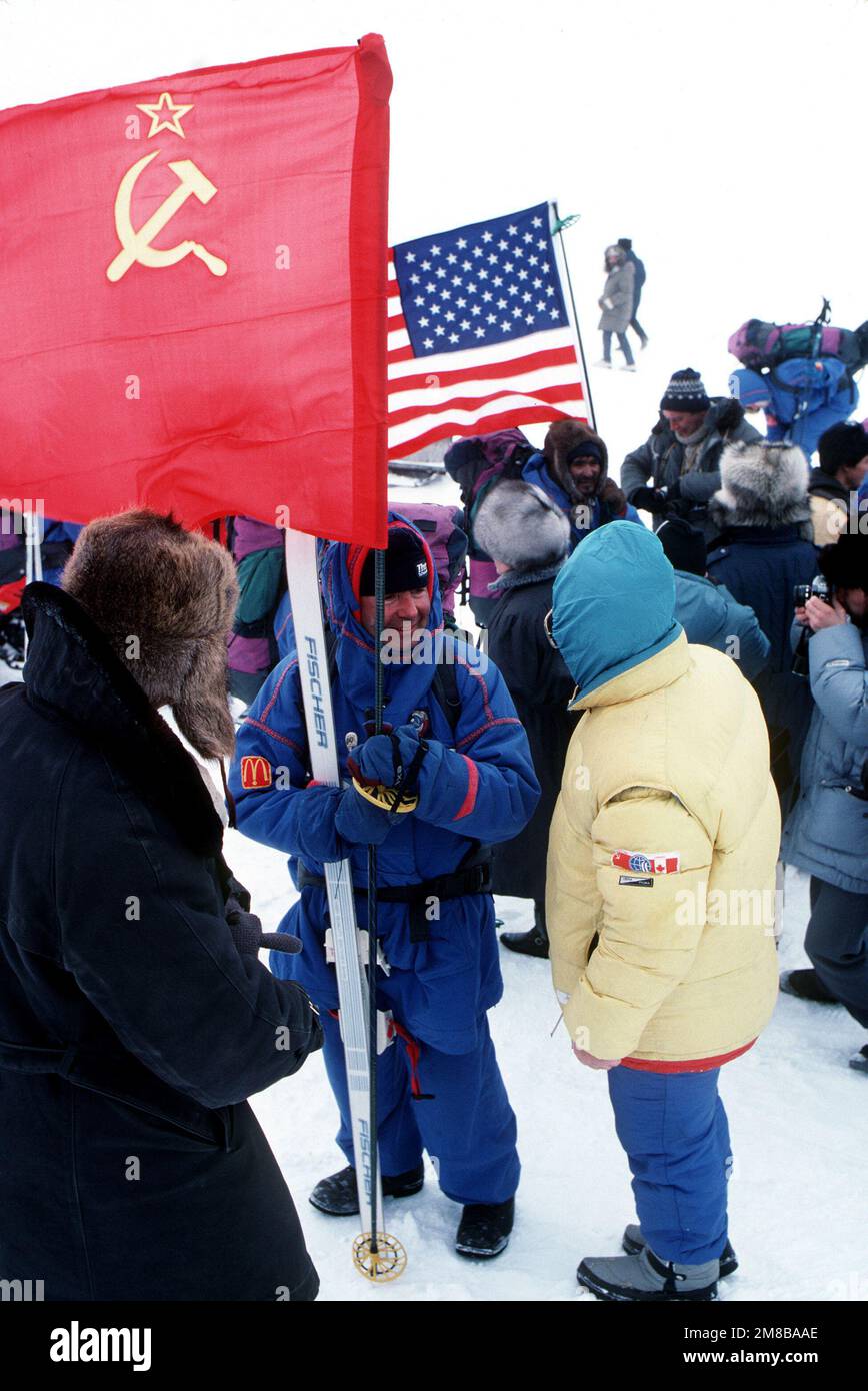 Members of the joint Soviet-American Bering Bridge Expedition plant ...