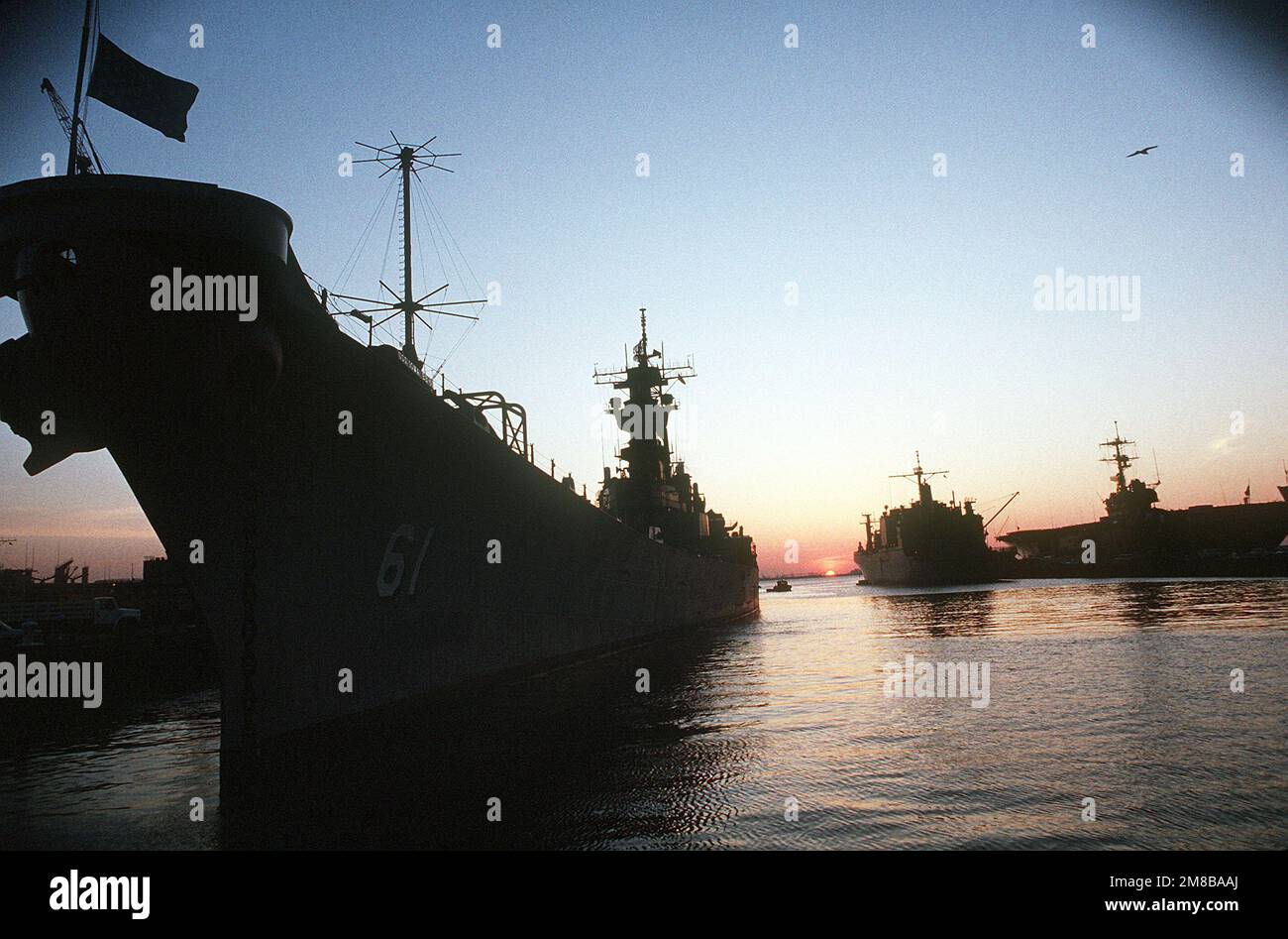 A port bow view of the battleship USS IOWA (BB-61) at sunset, in home port four days after an ...