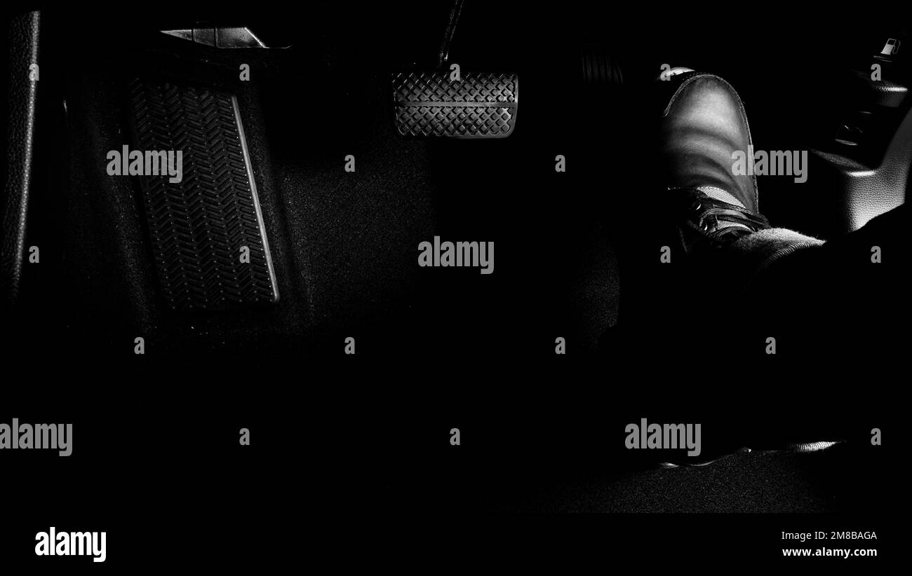 Car accelerate and brake foot pedal. Close up foot press or push foot ...