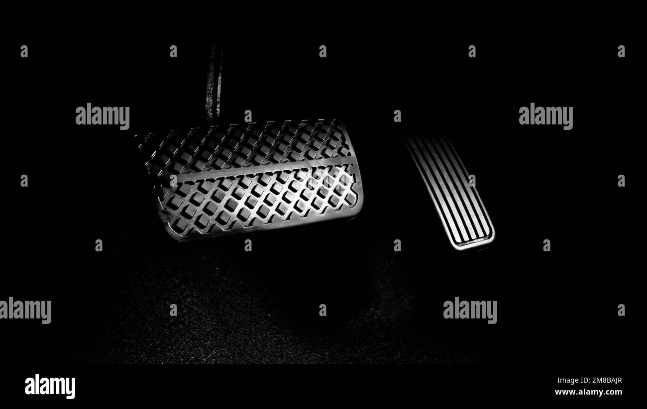 Car accelerate and brake foot pedal. Close up foot press or push foot ...