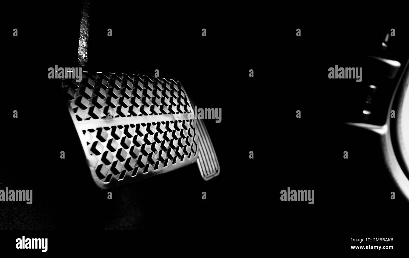 Car accelerate and brake foot pedal. Close up foot press or push foot ...