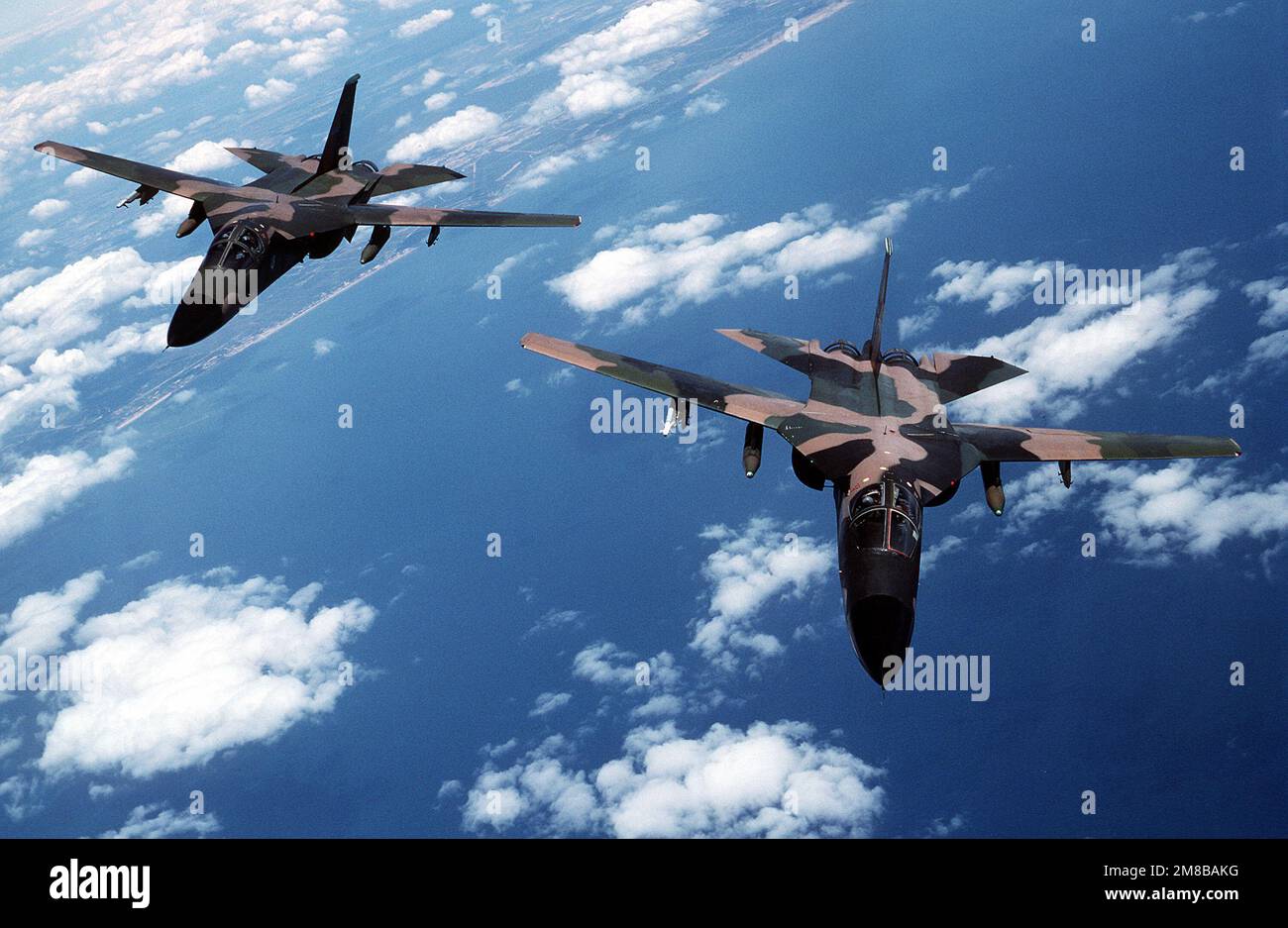 An air-to-air front view of two 495th Tactical Fighter Squadron F-111F ...