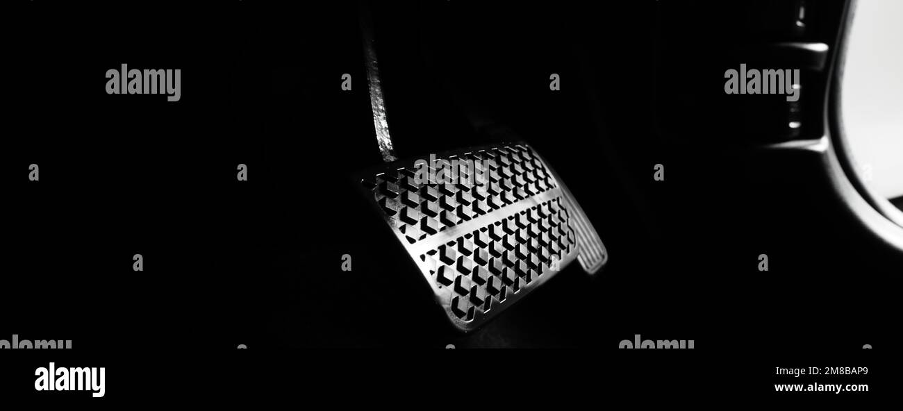 Car accelerate and brake foot pedal. Close up foot press or push foot ...
