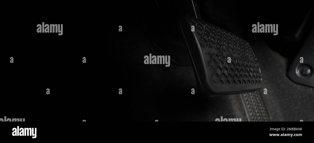 Car accelerate and brake foot pedal. Close up foot press or push foot ...