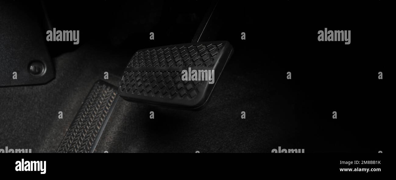Car accelerate and brake foot pedal. Close up foot press or push foot ...