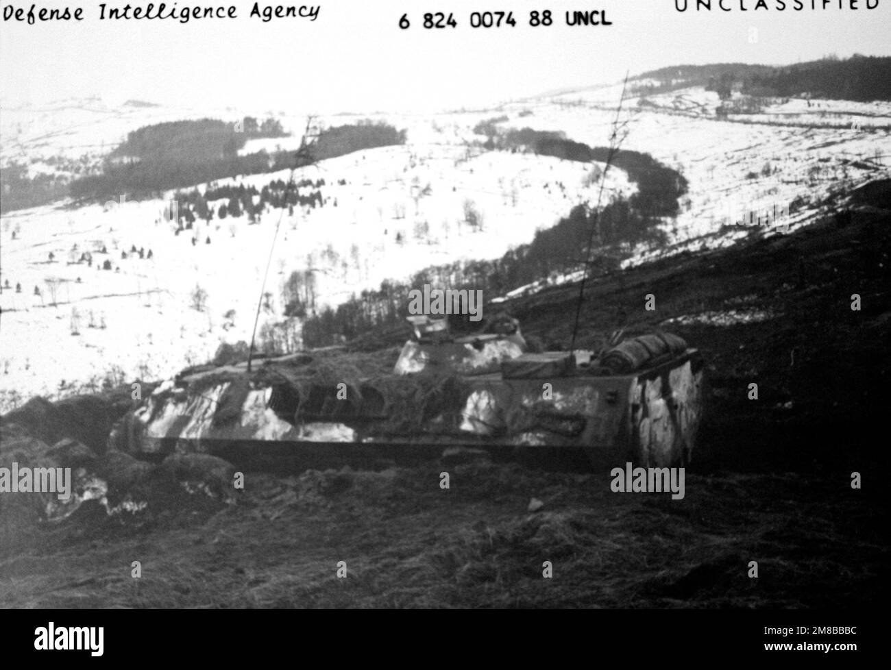 A left rear view of a dug-in and camouflaged Soviet BMP-1 tracked ...