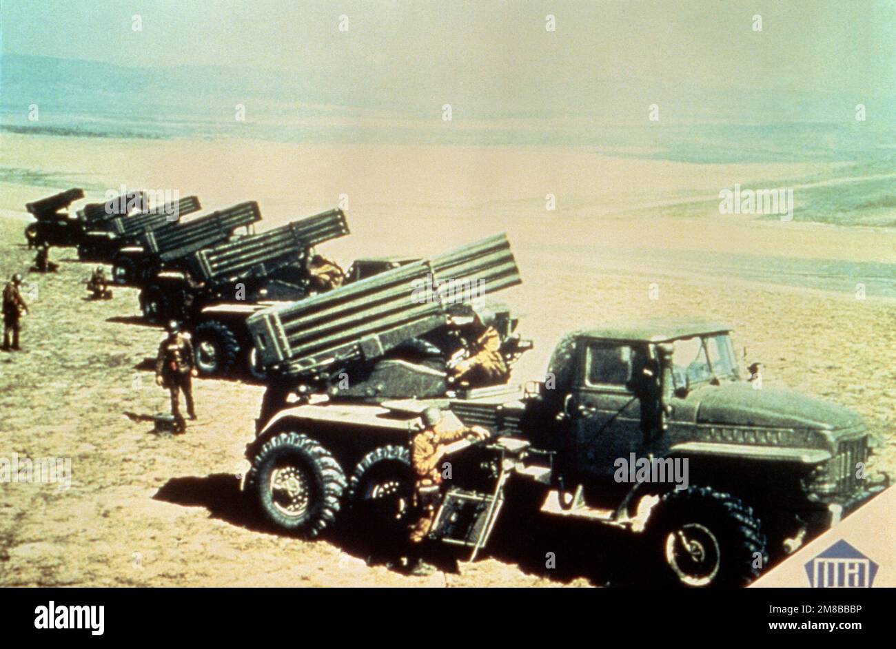 A right side view of six Soviet 122mm BM-21 multiple rocket launcher ...