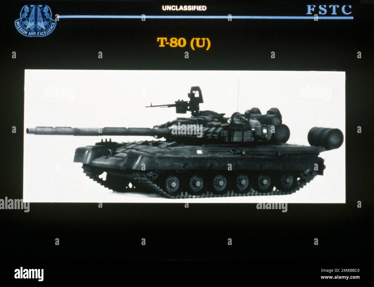 A left front view of a Soviet T-80 main battle tank carrying a range ...