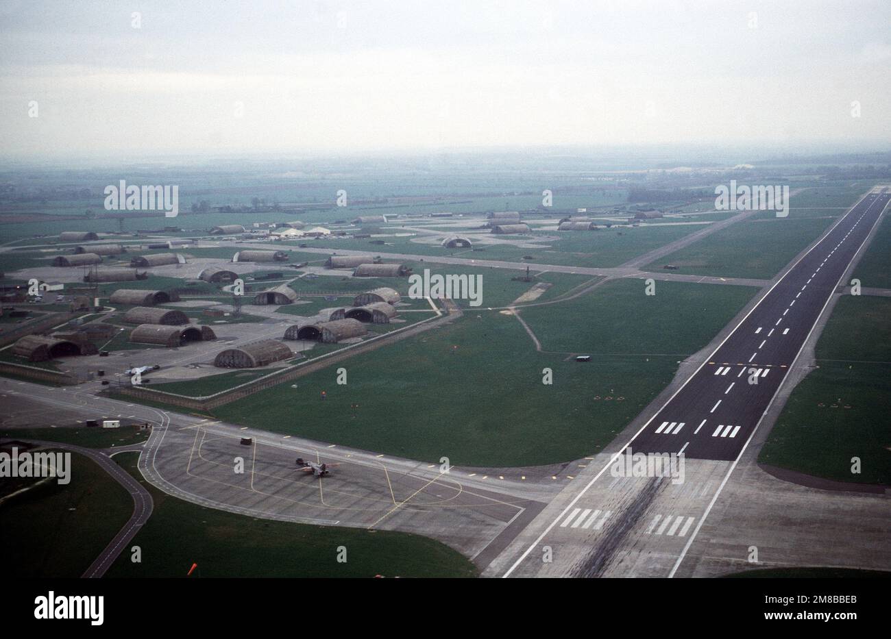 An aerial view of a portion of the base, showing the main runway and ...