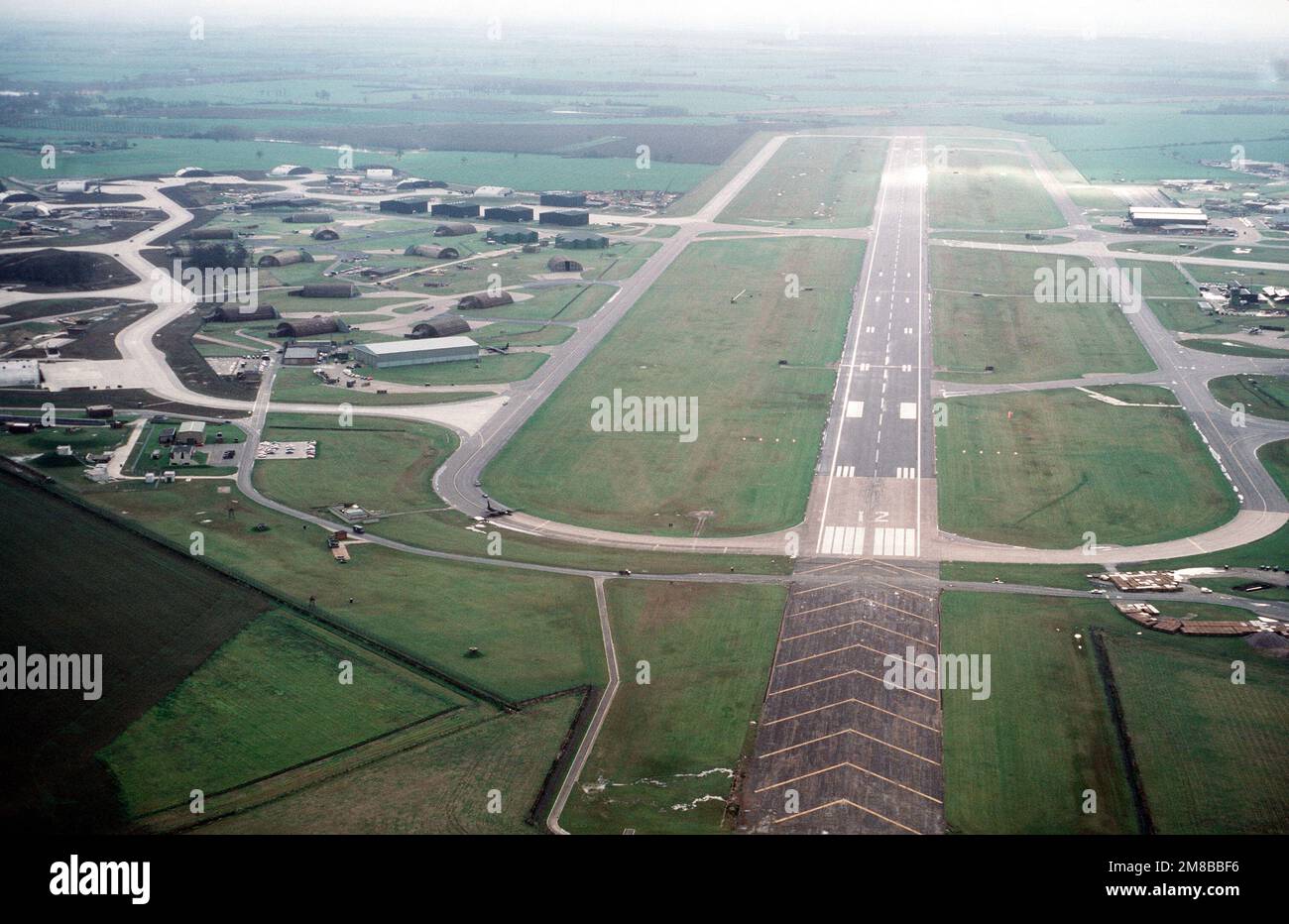 An aerial view of a portion of the base, showing the main runway and ...