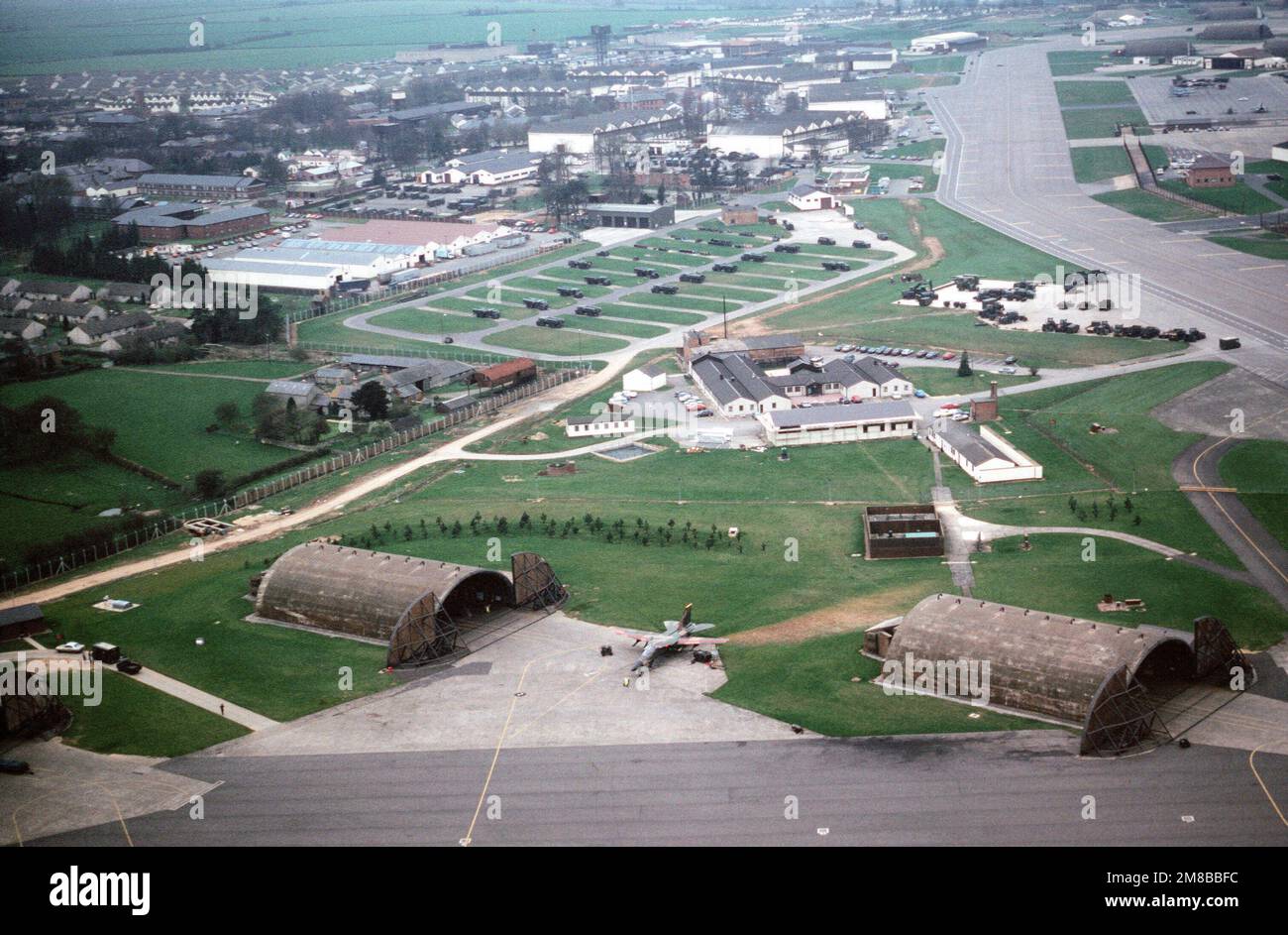 An aerial view of a hangar area on the base, showing an EF-111 aircraft ...