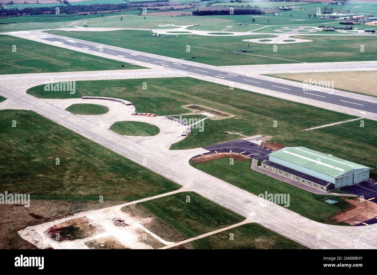 An aerial view of the base's main runway and hangar area on the base ...