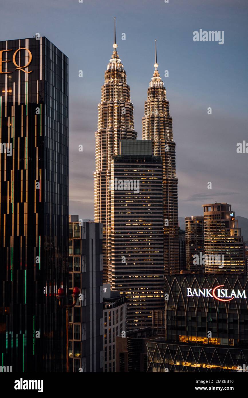 A landscape of Petronas Twin towers during sunset in city center ...