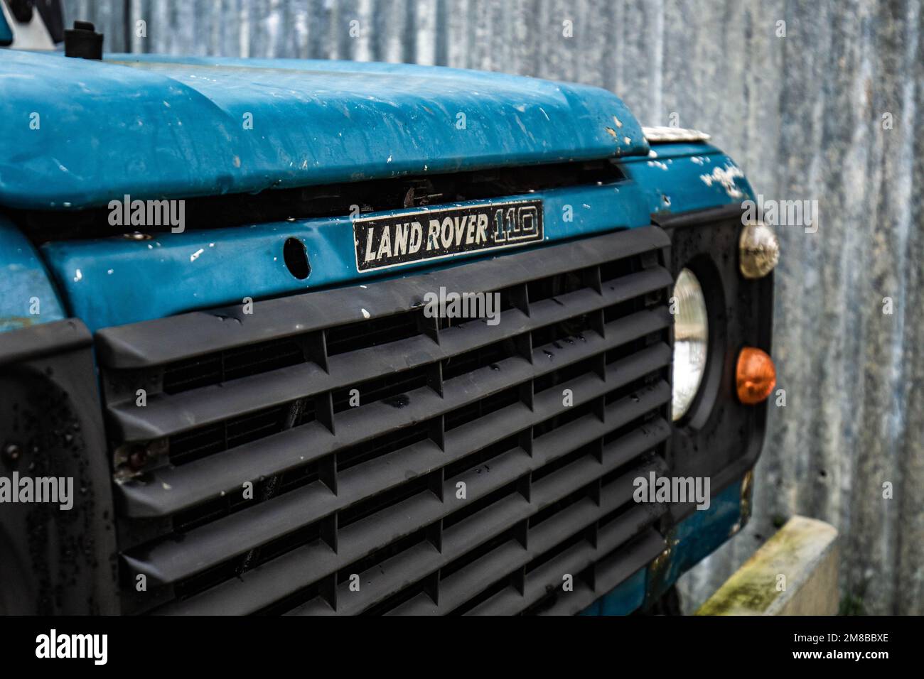 Old classic vintage pick-up Land Rover next to metal shed Stock Photo ...