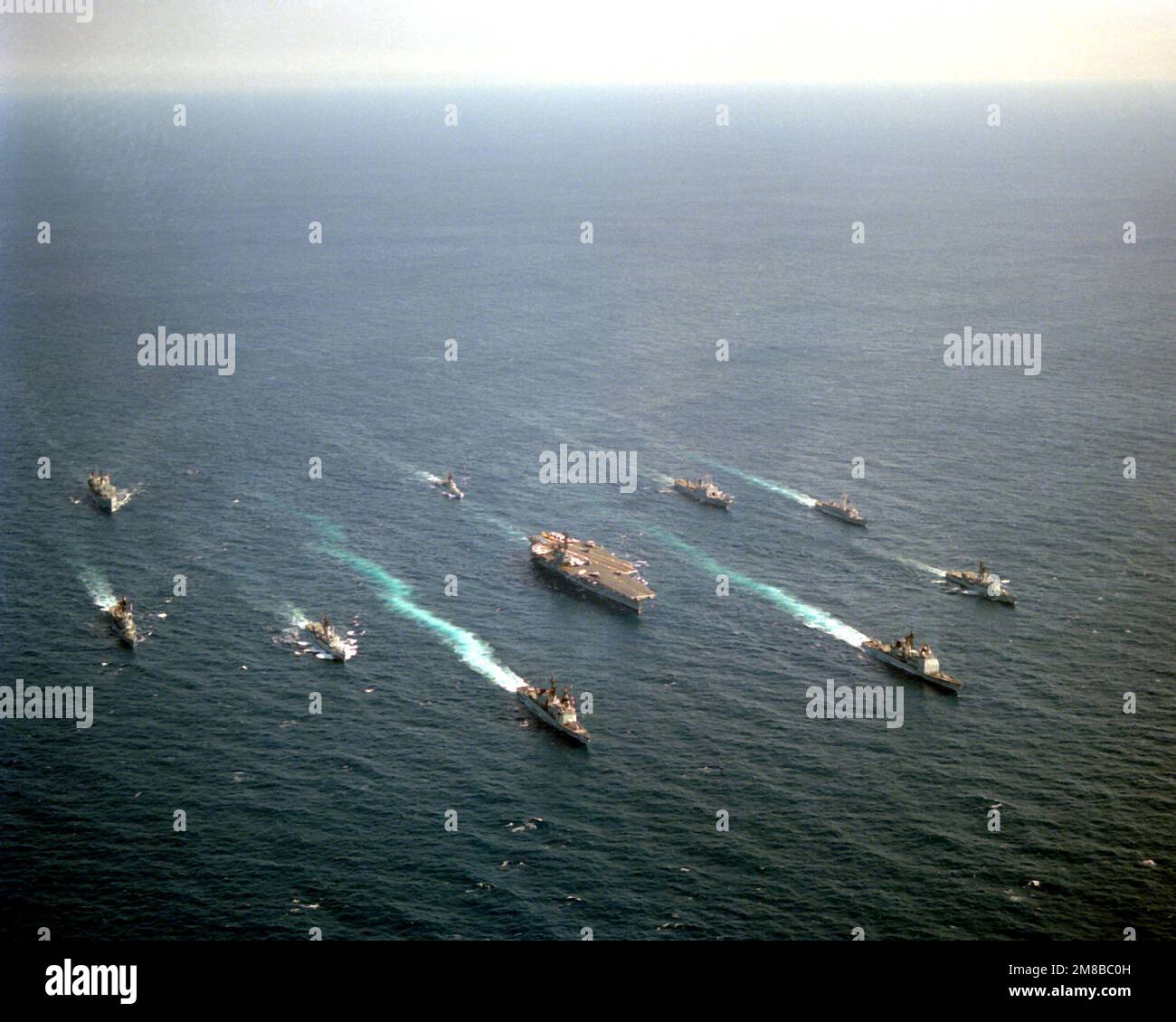 The aircraft carrier USS FORRESTAL (CV-59) sails at the center of its ...