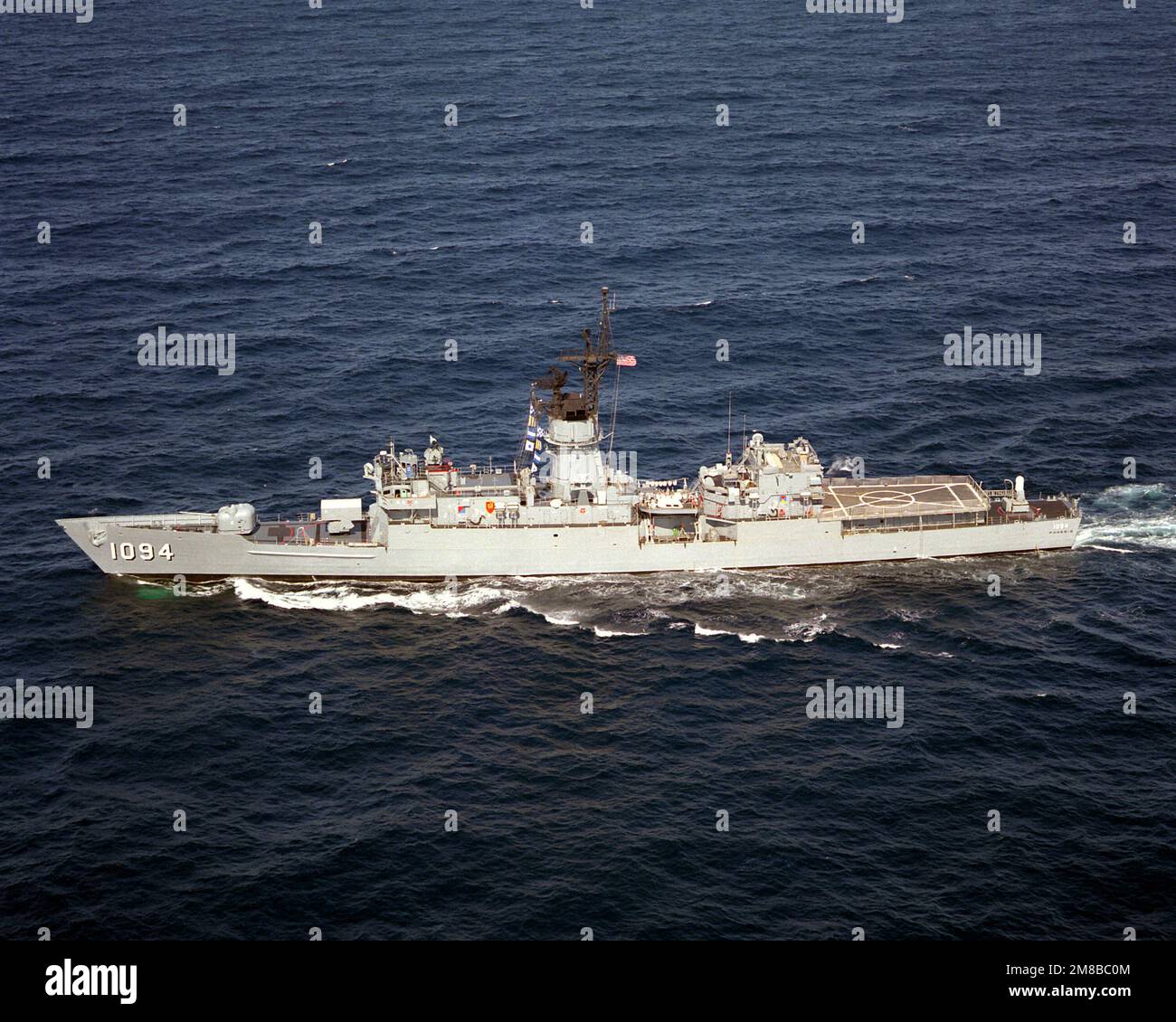 A port beam view of the frigate USS PHARRIS (FF-1094), one of the ships ...