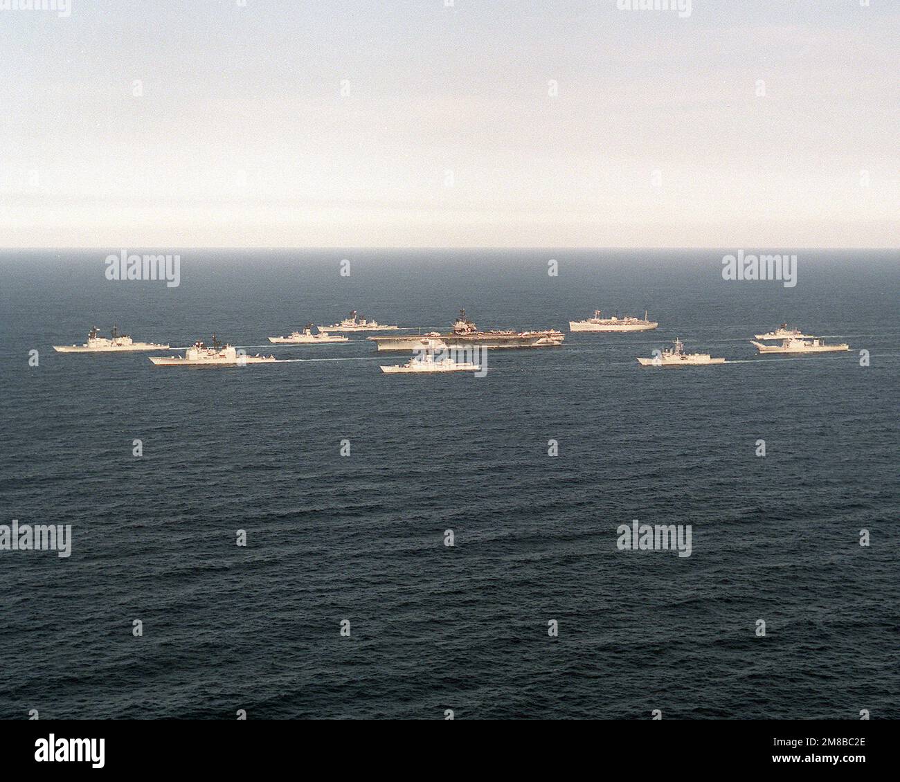 A port side view of the aircraft carrier USS FORRESTAL (CV-59) and its ...