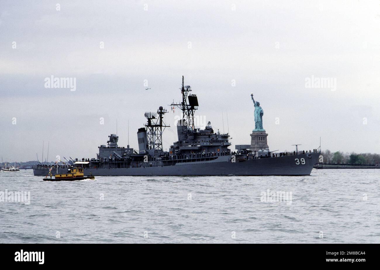 The guided missile cruiser USS MACDONOUGH (DDG 39) steams past the ...