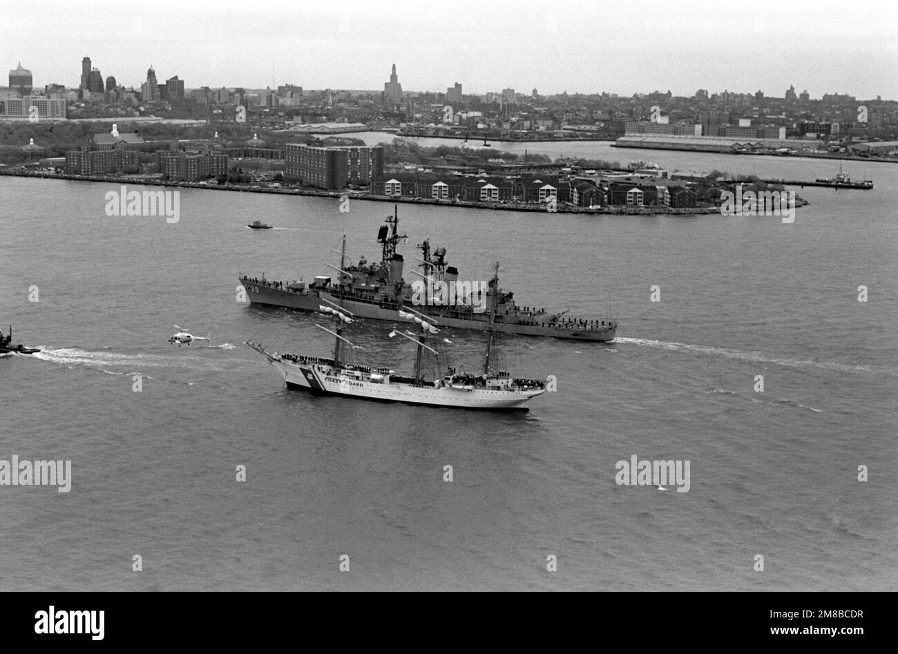 The guided missile destroyer USS MACDONOUGH (DDG 39) passes between the ...