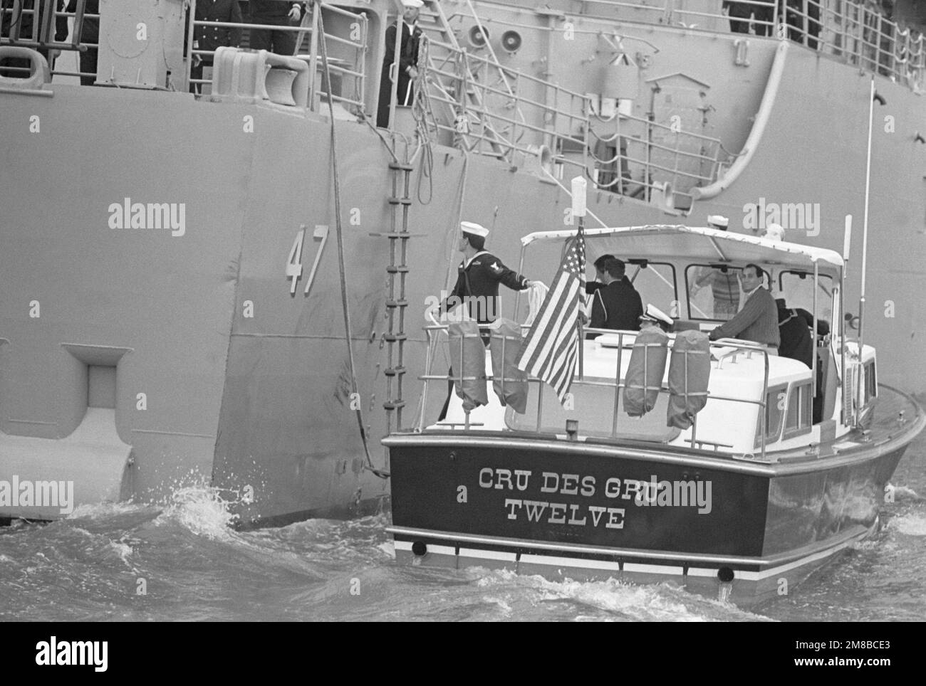 A sailor aboard a 40-foot personnel boat assigned to the commander of ...