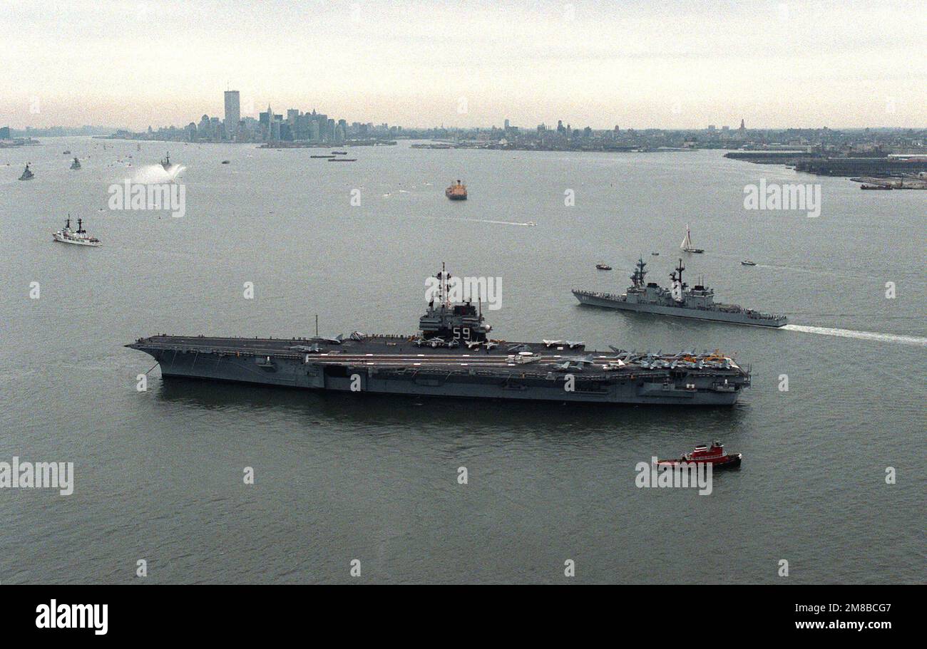 The destroyer USS HAYLER (DD-997) and other U.S. Navy ships pass the ...