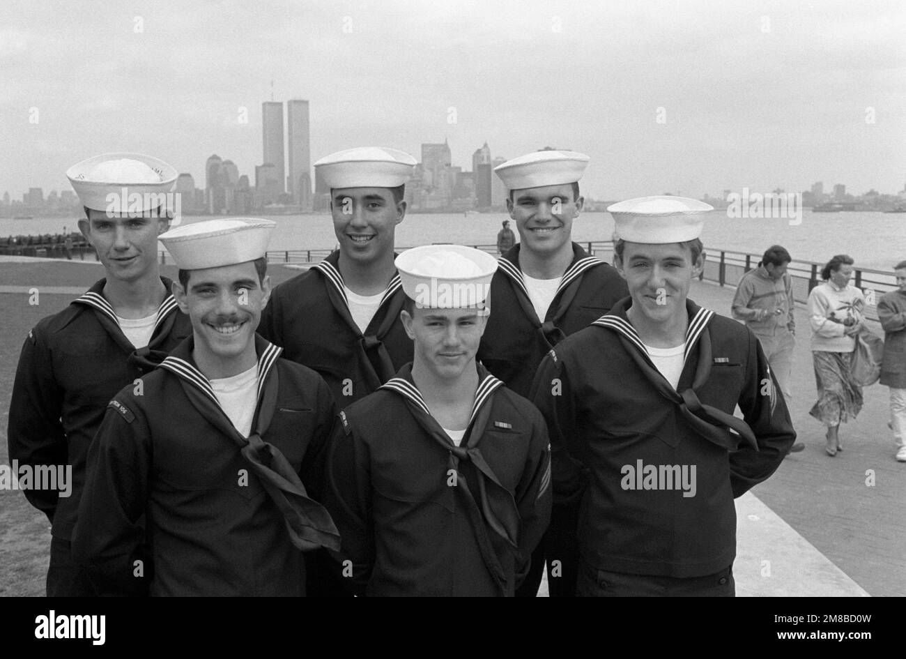 A group of sailors gathers for a photograph on Liberty Island during a ...