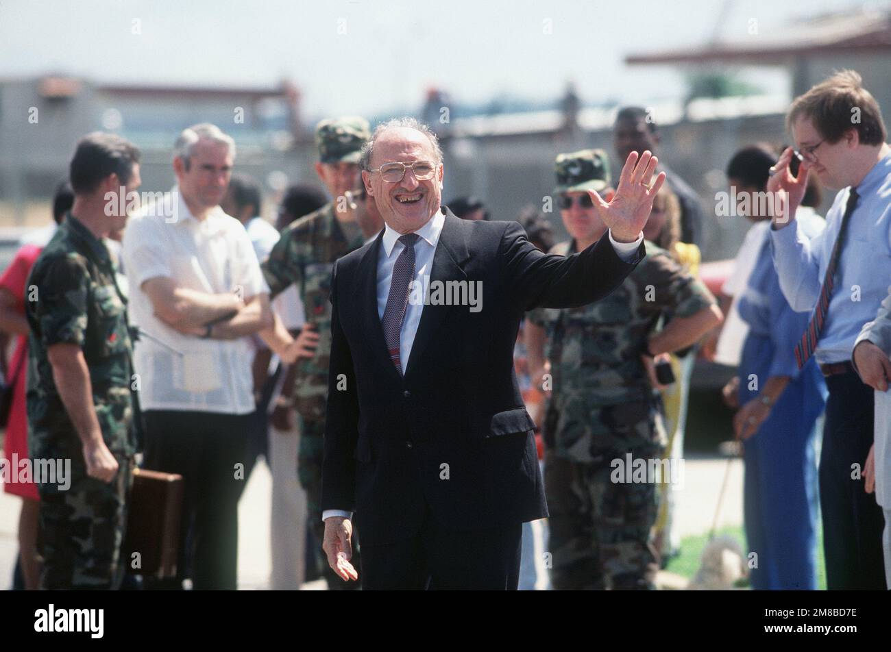 US Ambassador Arthur Davis waves goodbye to well-wishers before ...