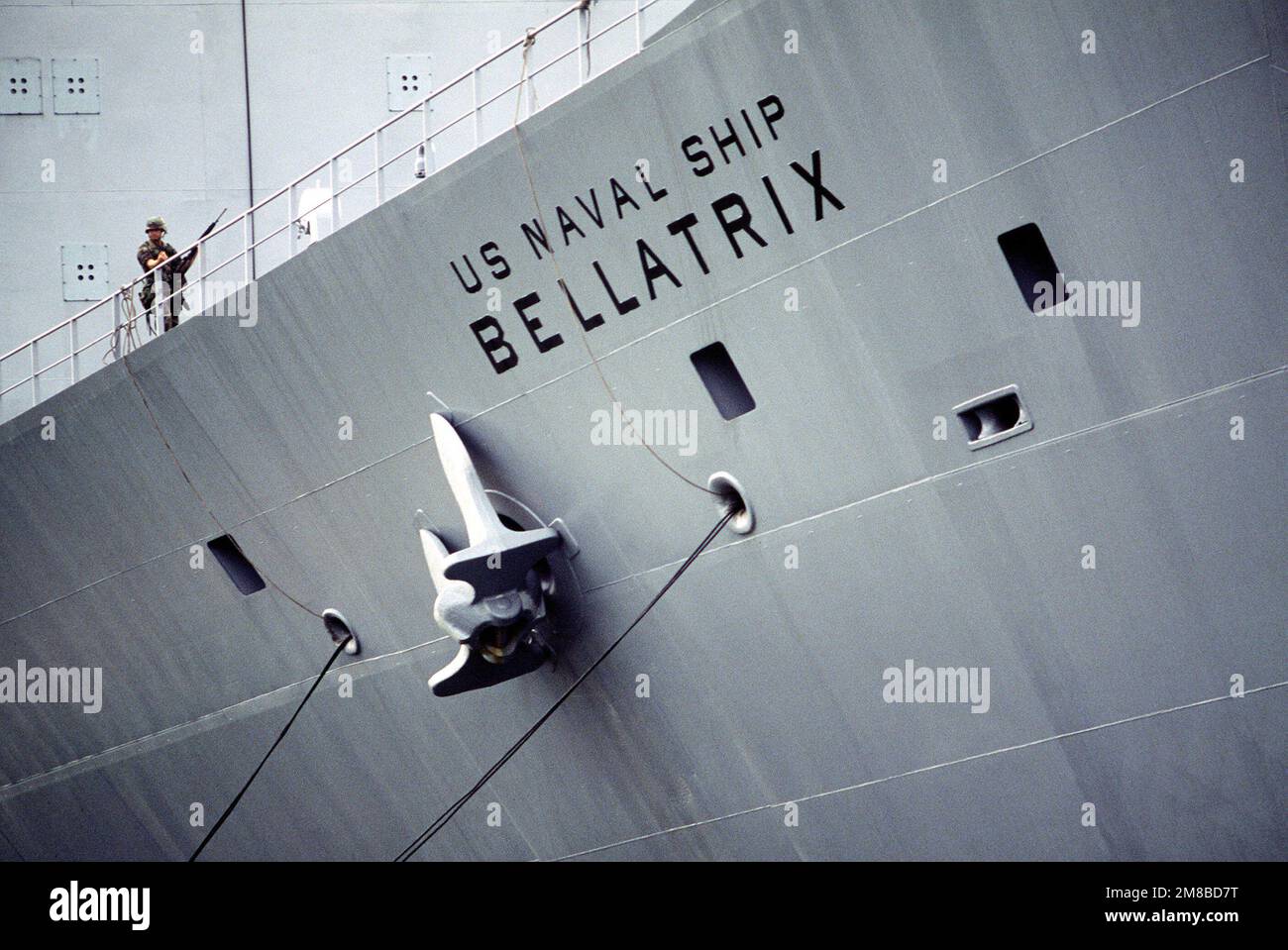 At the Miraflores Locks, a Marine stands guard at the rail of the cargo ...