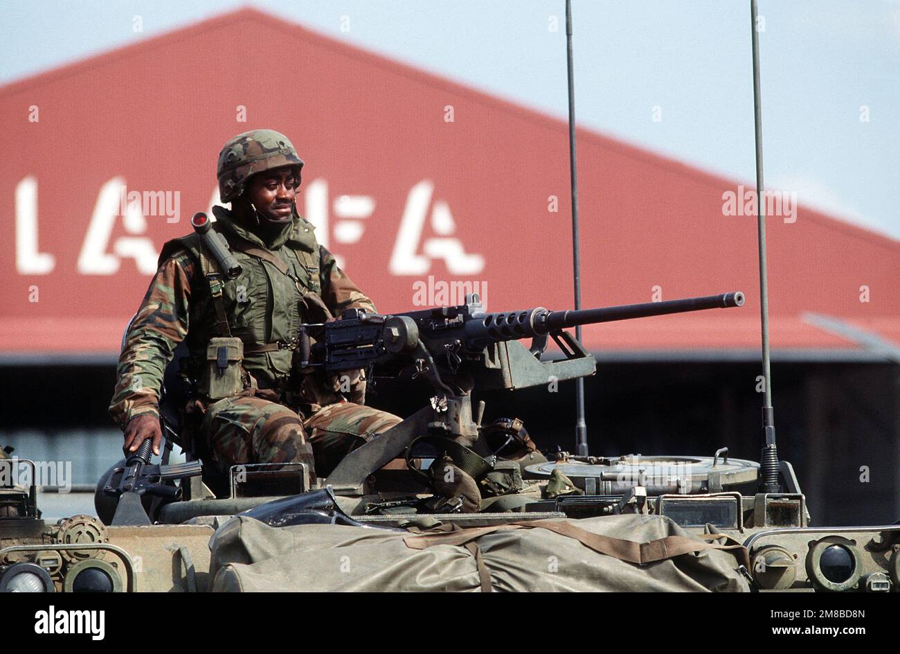 SPEC. 4 Brian Bates mans the M-2 .50-caliber machine gun on an M-113 ...