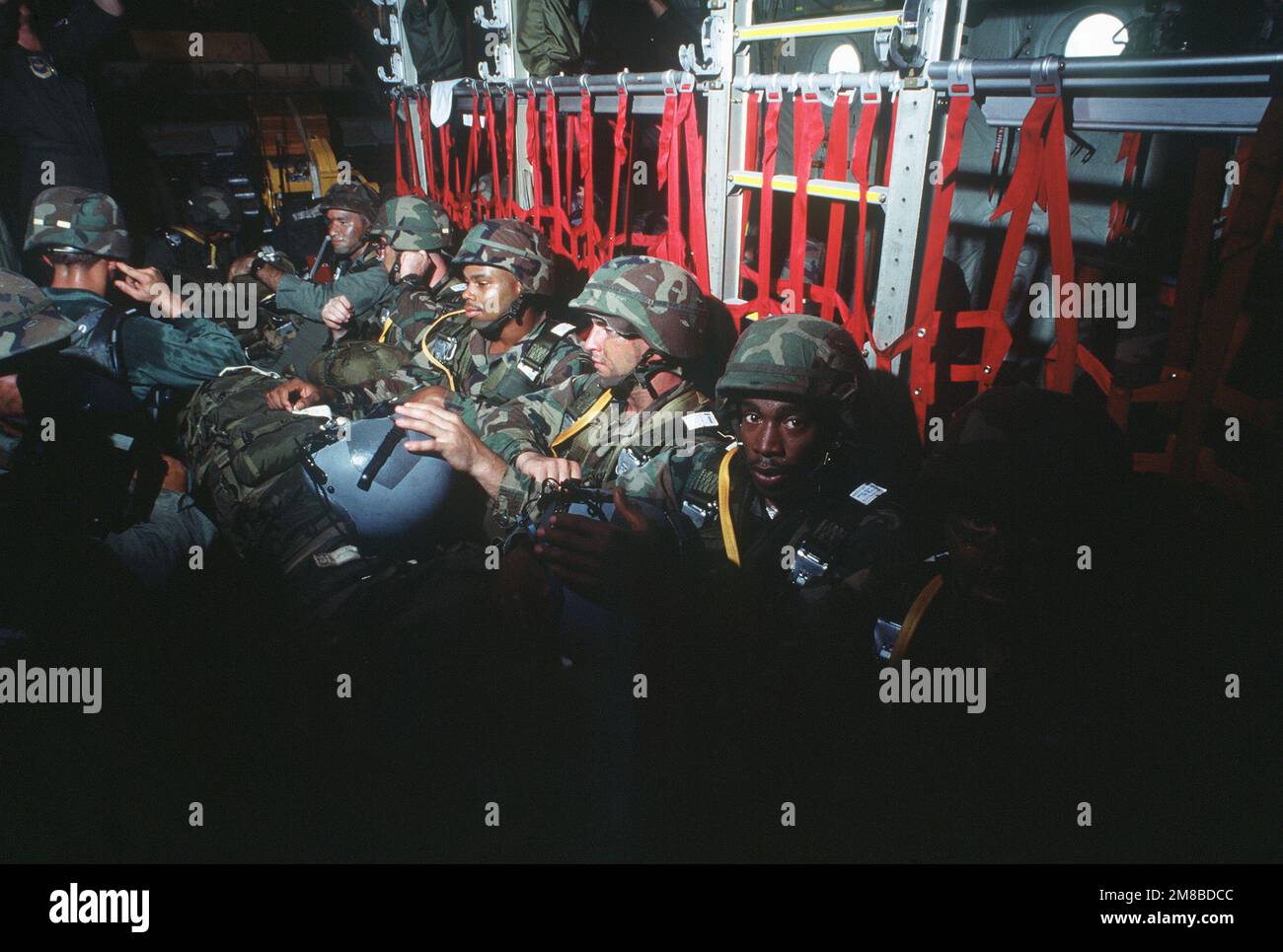 Members of the 508th Airborne Division sit in the hold of a C-130 ...