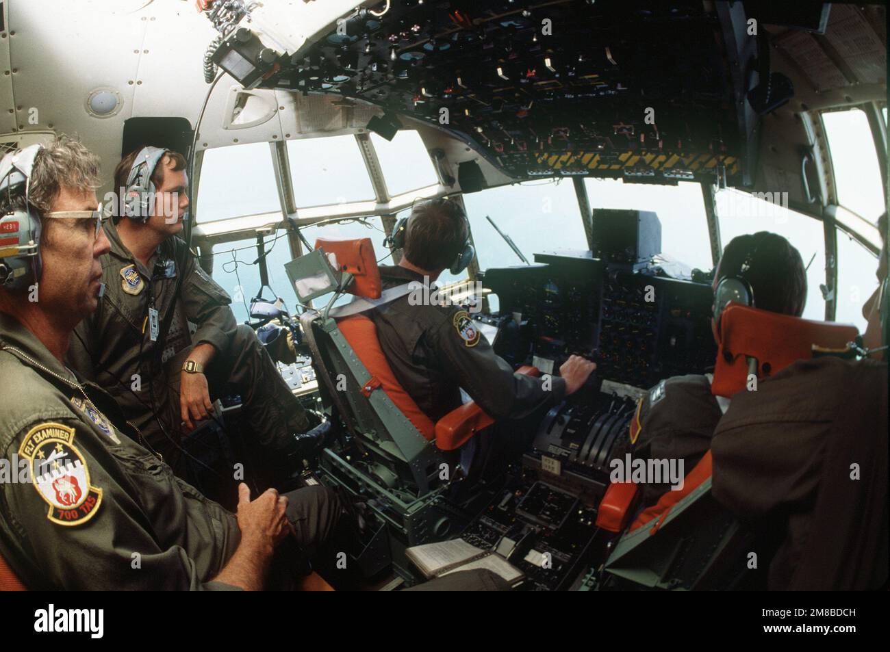 A view of the crew inside the cockpit of a C-130 Hercules aircraft on ...
