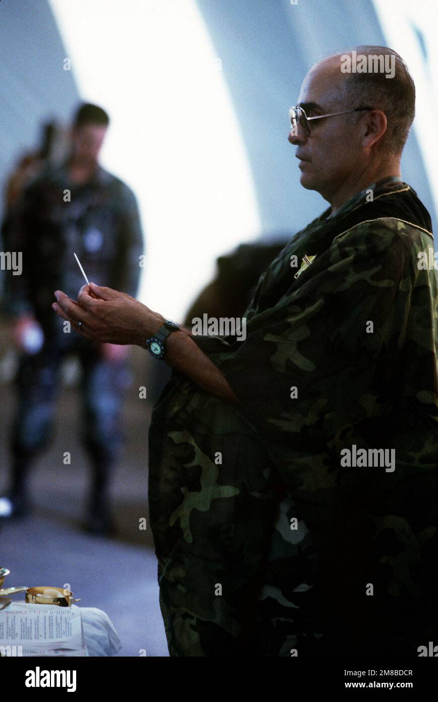 COL. Mike Ties, Southern Command chaplain, prepares communion at mass ...