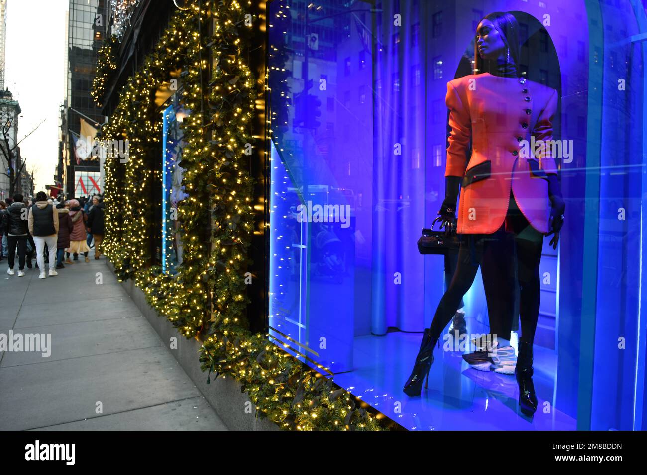 Spectators view holiday window display at Saks Fifth Avenue in NYC ...