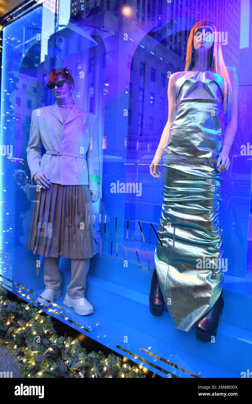 Spectators view holiday window display at Saks Fifth Avenue in NYC ...