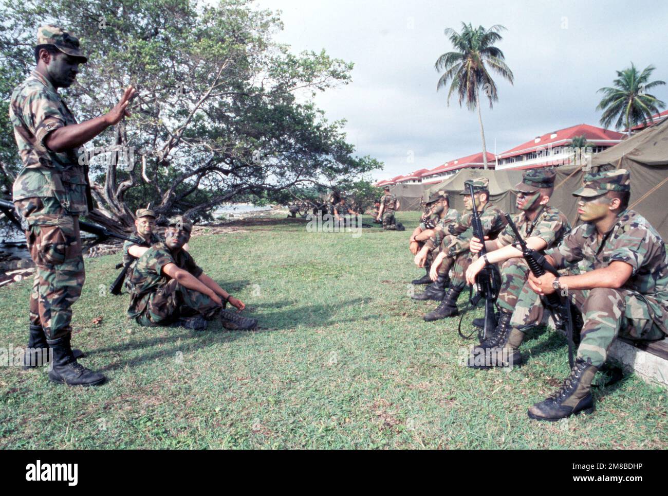 Soldiers equipped with M16A2 rifles are taught basic marksmanship. Base ...