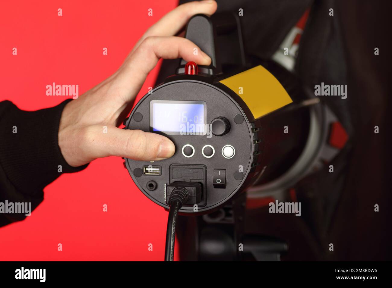 studio flash rear control panel on tripod and pink background Stock ...