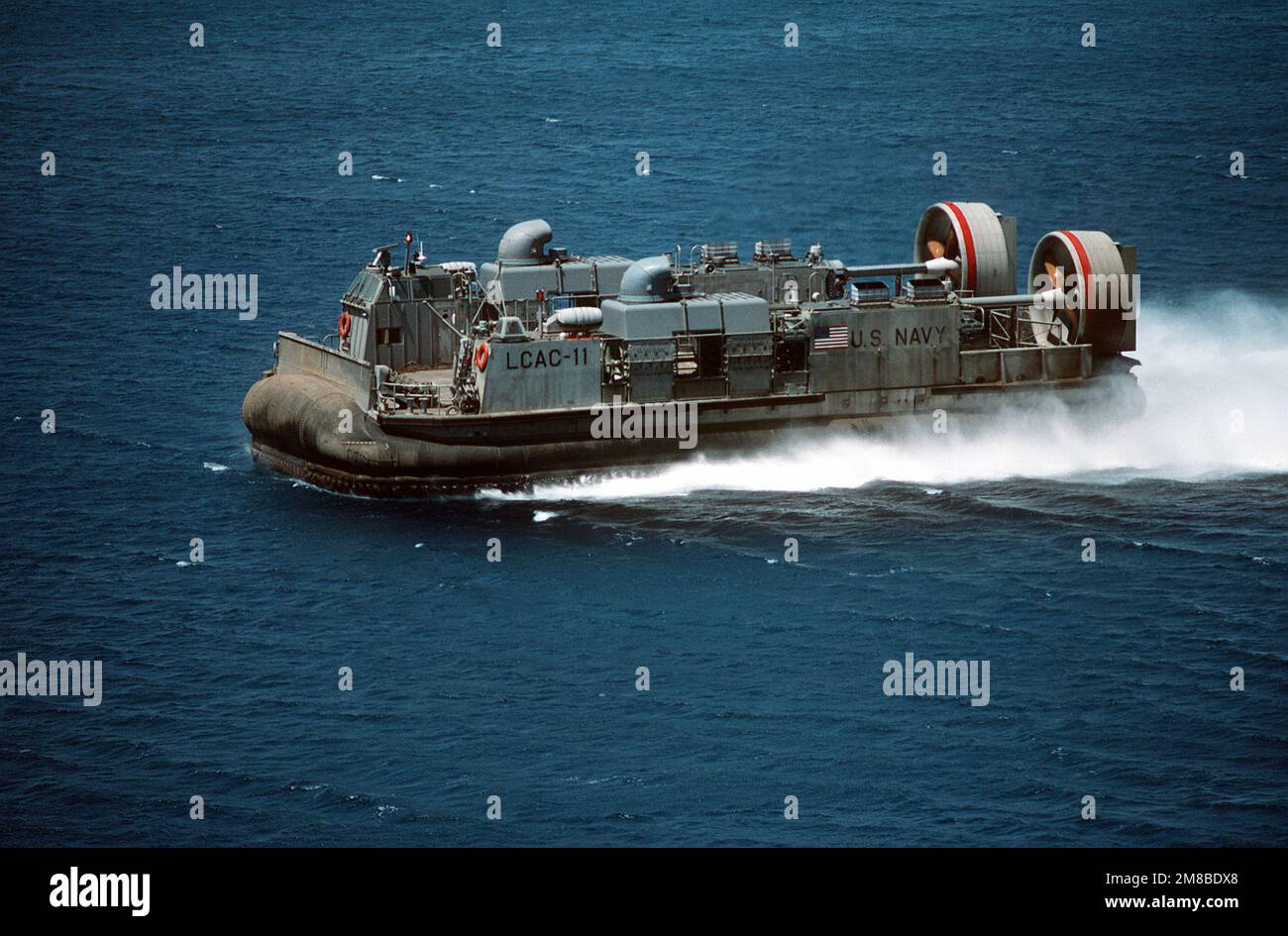 A port view of the air cushion landing craft LCAC-11 as it speeds ...