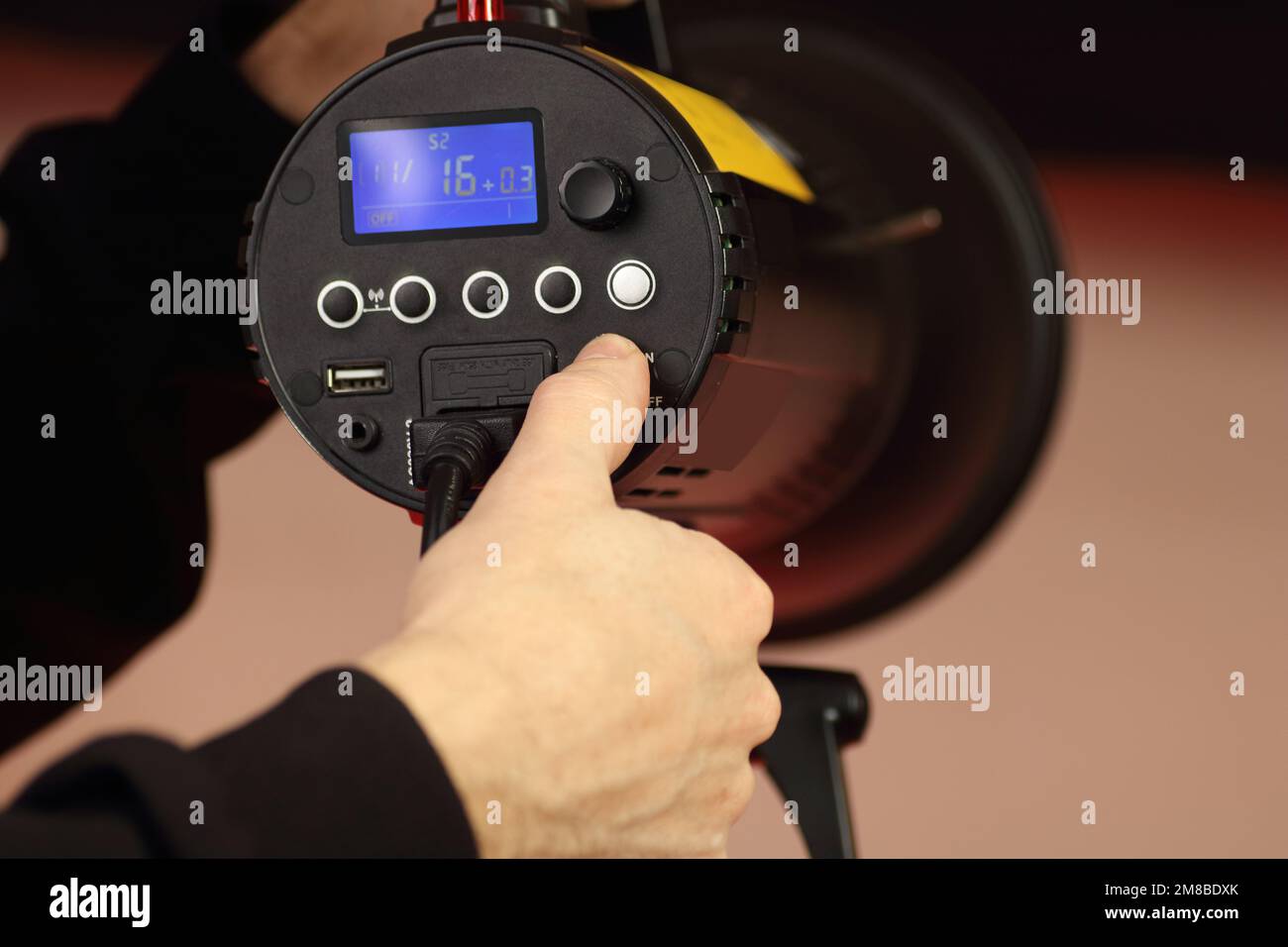 studio flash rear control panel on tripod and pink background Stock ...