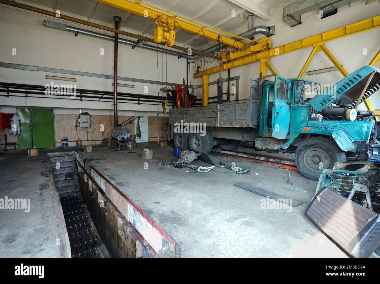 At the car mechanic workshop. Very old truck being repaired, vehicle ...