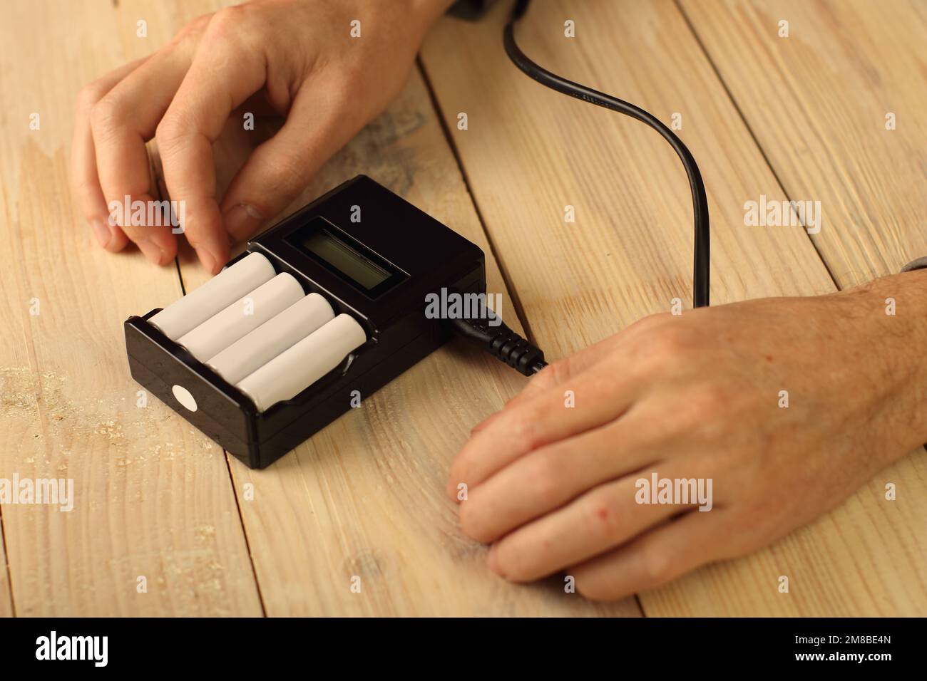 Charger batteries in hand hi-res stock photography and images - Alamy