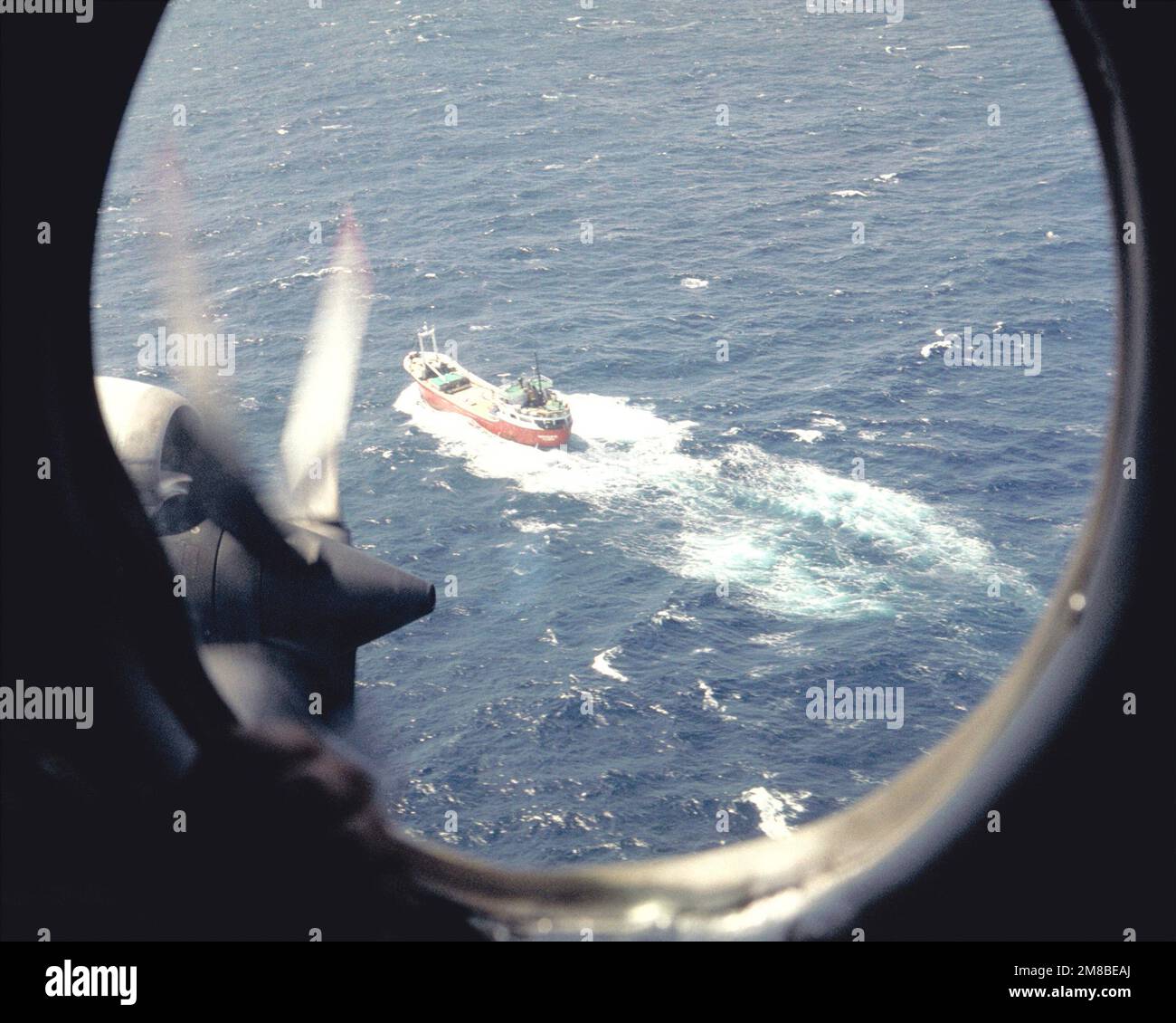 An aerial view of a small merchant ship steaming south of England ...