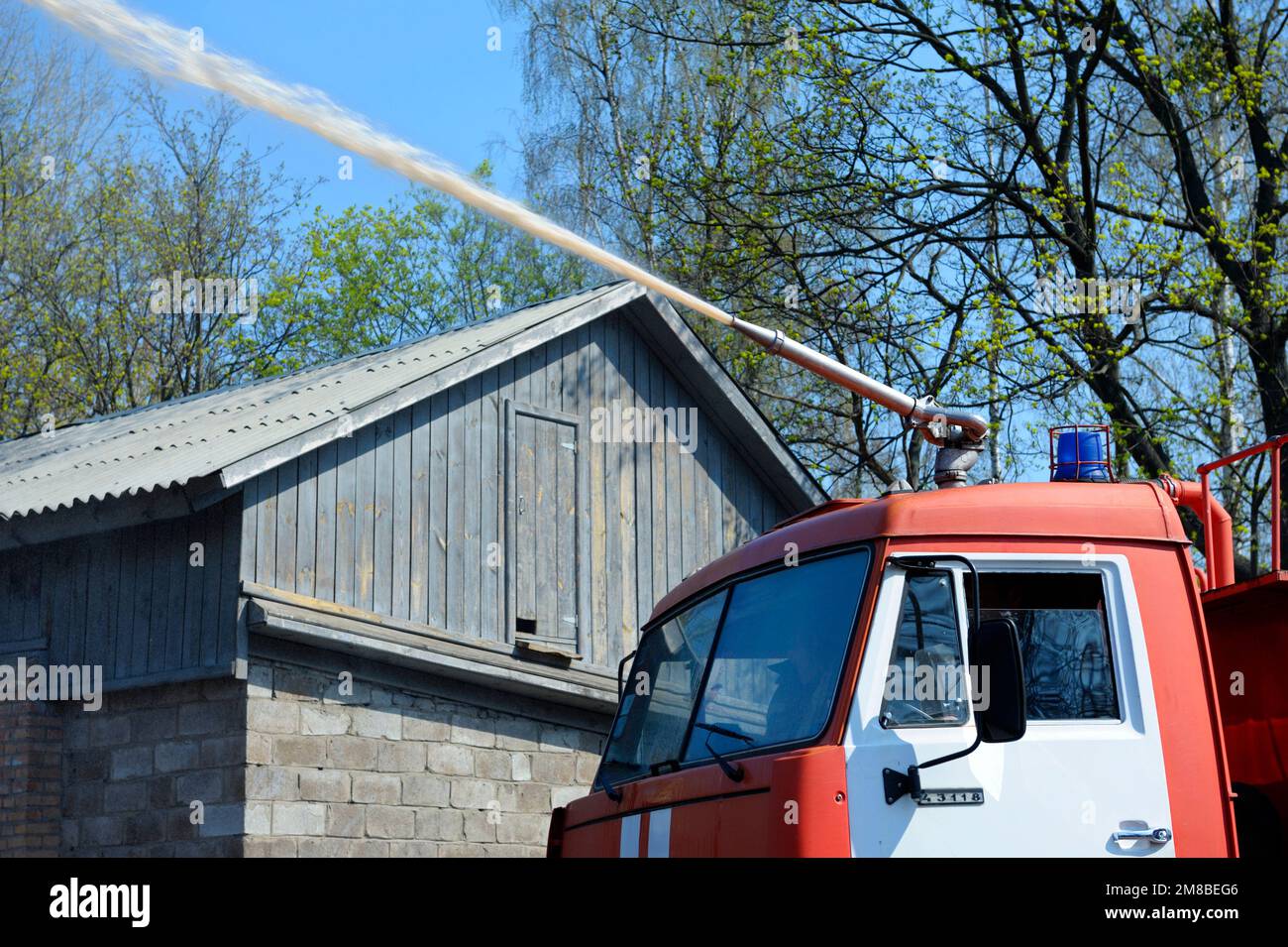Water cannon of a firetruck shooting a high-velocity stream of water ...