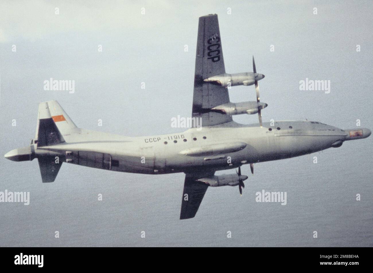 An air-to-air right side view of a Soviet An-12 Cub aircraft, modified ...