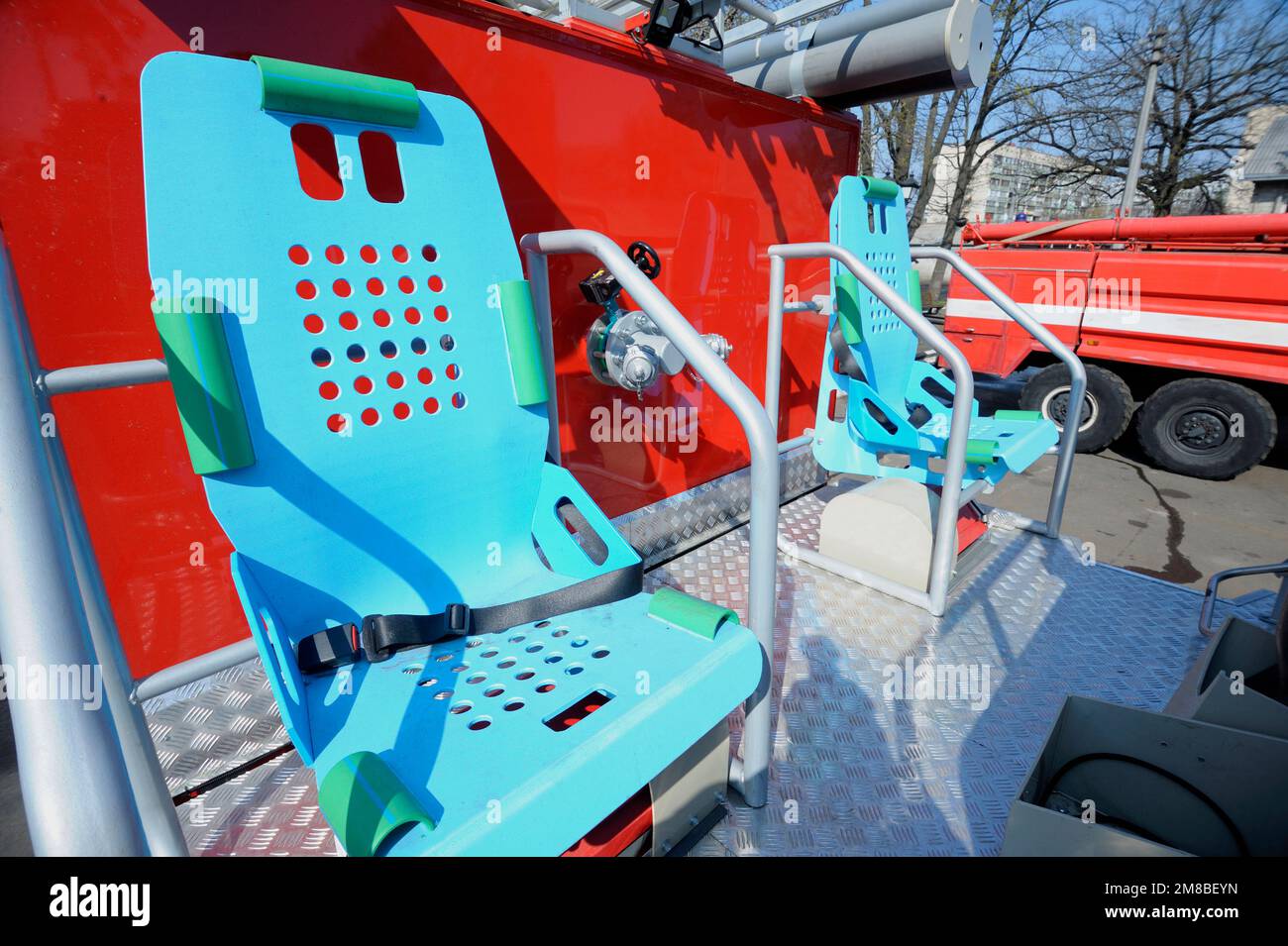 Seats for firefighters set on a firetruck Stock Photo - Alamy