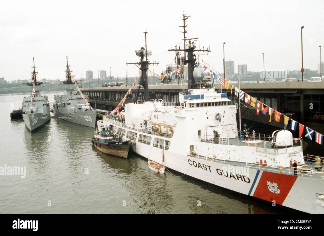 The Coast Guard cutter USCGC HAMILITON (WHEC 715) is moored in front of ...