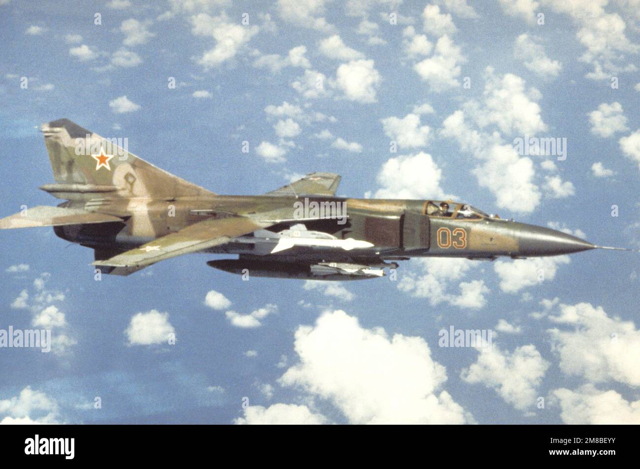 An air-to-air right side view of a Soviet MiG-23 Flogger aircraft ...