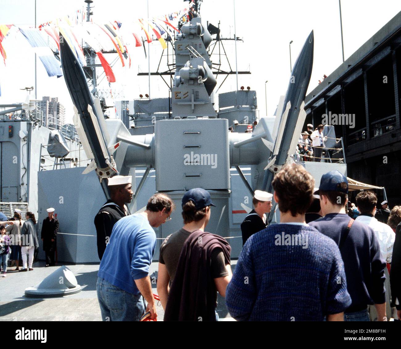 Visitors study the Standard (SM-2 ER) RIM-67B missiles mounted in the ...