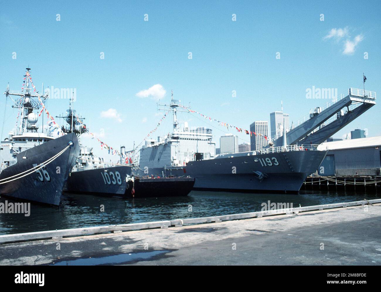 A starboard bow view of, from left: the guided missile frigate USS ...