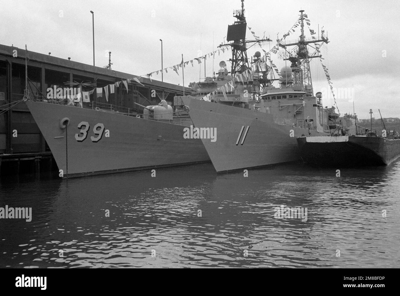 The guided missile destroyer USS MACDONOUGH (DDG 39), left, and the ...