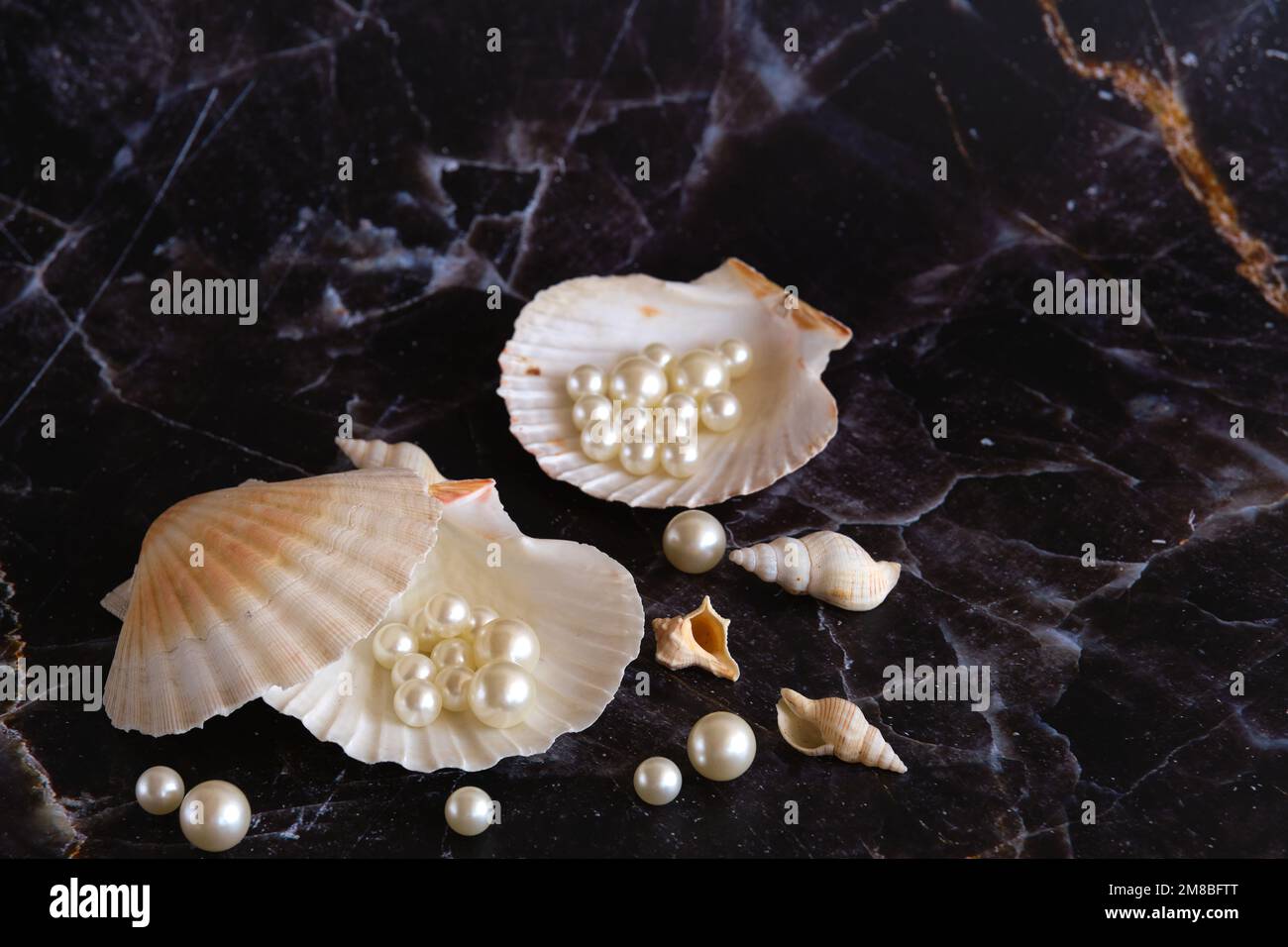 a few pearls in a sea shell Stock Photo - Alamy